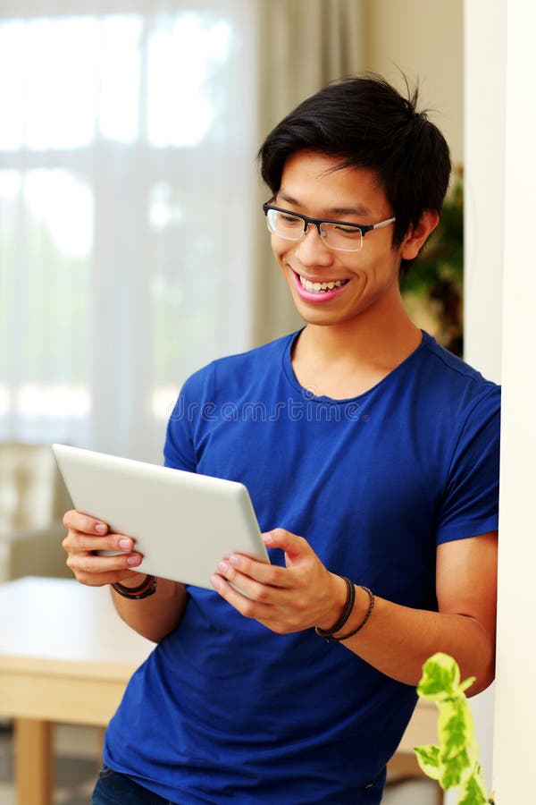 Asian Man Using Tablet Computer Stock Photo - Image of person, student ...