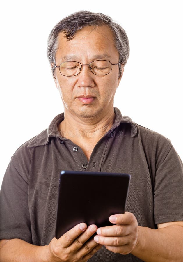 Asian man using tablet stock image. Image of grandparent - 32846917