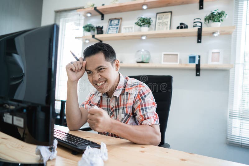 Asian Man Waiting for Something Looking at Pc Stock Photo - Image of ...