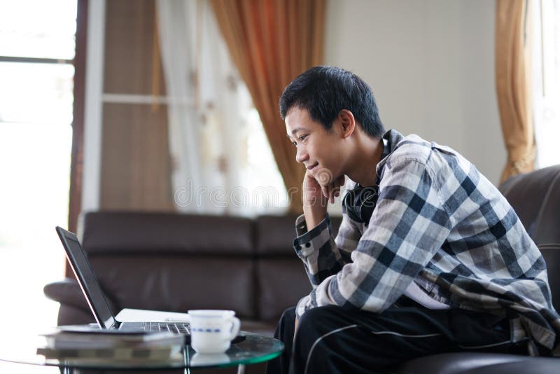 Asian Man Watching a Laptop Computer Stock Photo - Image of speaker ...