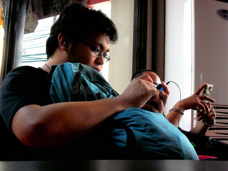 Asian Man Watching Video on His Smartphone Editorial Stock Image ...