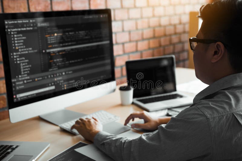Software Developer Is Pointing To The Paper Working And Analyzing Together The Code Written Into