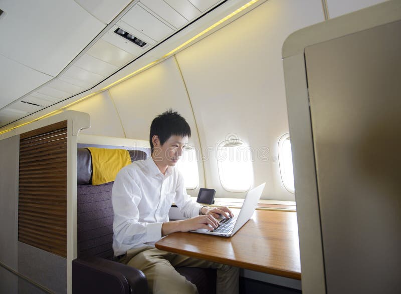 Asian Man Working on First Class Airplane Stock Photo - Image of ...