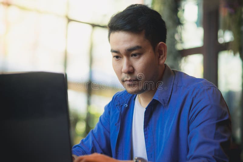 Asian Man Working with Laptop in Cafe, Stock Image - Image of ...