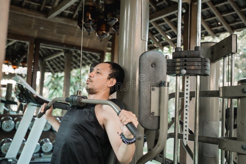 Asian Man Workout with Lat Pulldown Machine Stock Image - Image of ...