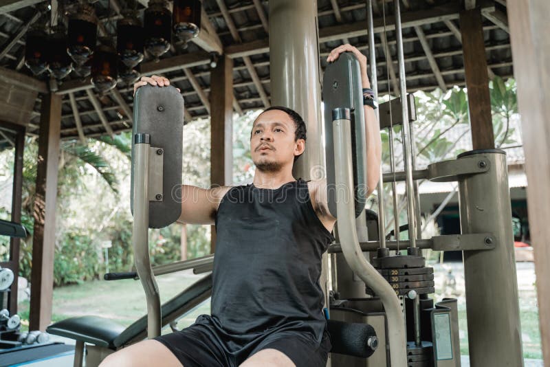 Asian Man Workout with Pec Deck Machine Stock Image - Image of active ...