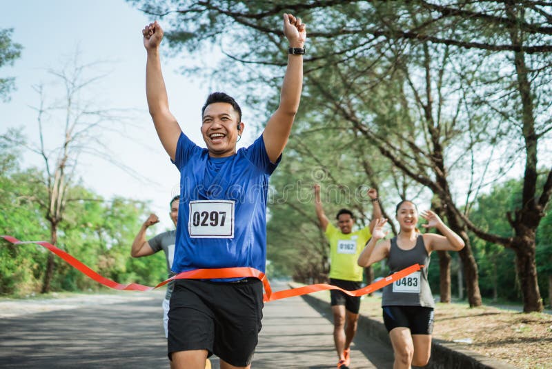 Asian Marathon Participant Crossing Finish Line Stock Photo - Image of ...