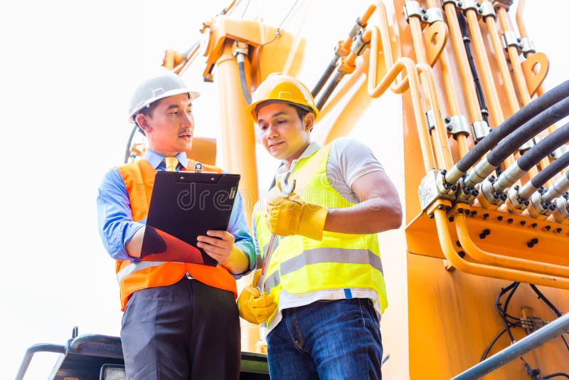 Asian Mechanic with Construction Machine Stock Photo - Image of pipes ...