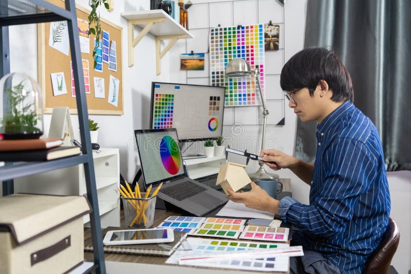 Asian Men Architect or Graphic Designer Designing a Layout Selection ...