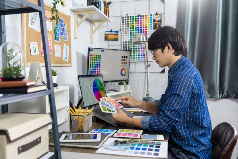 Asian Men Architect or Graphic Designer Designing a Layout Selection ...
