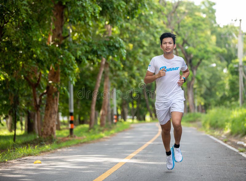 Asian Men Jogging and Running in the Park Stock Photo - Image of ...