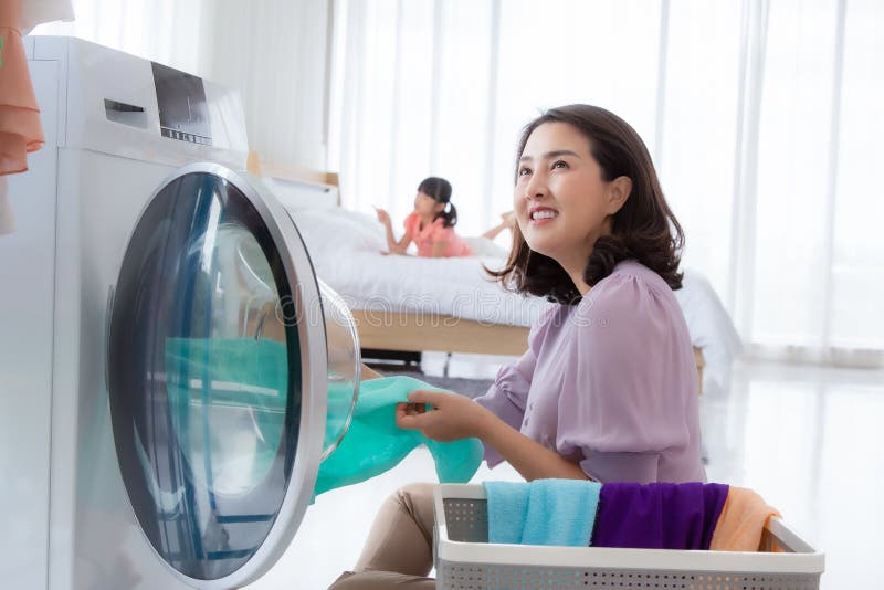 Asian Mom Loading Cloth To Washing Machine Doing Laundry Stock Photo ...