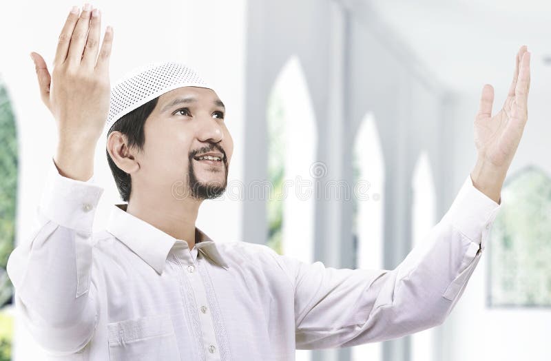 Asian Muslim Man Standing while Raised Hands and Praying Stock Image ...