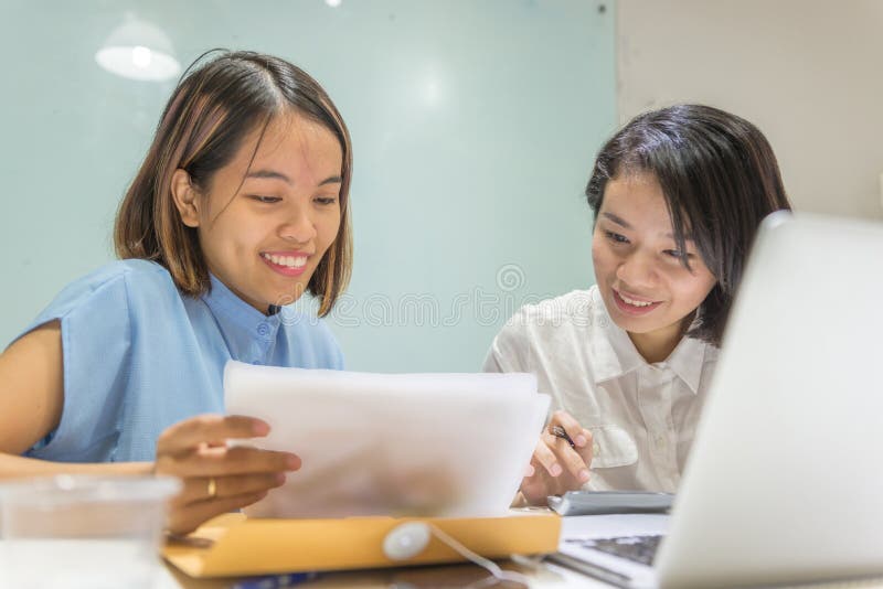 Asian Office Lady Discuss with Partner about Document Stock Image ...