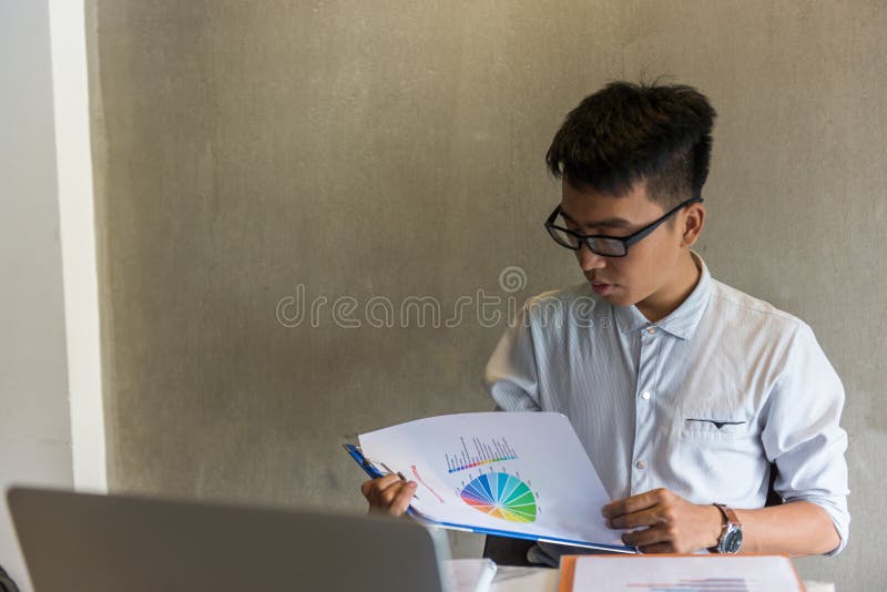 Asian Office Man Checking Data on the Document Stock Photo - Image of ...