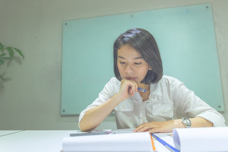 Asian Office Manager Checking Information on Report Stock Photo - Image ...