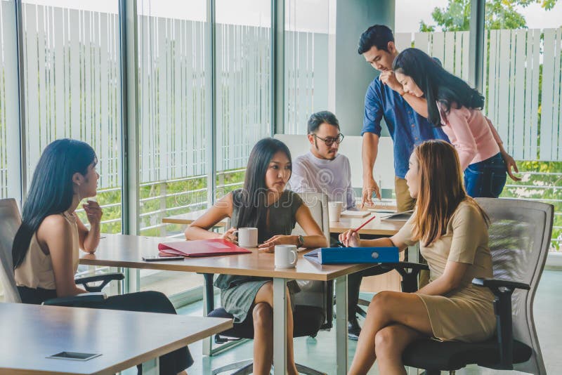 Asian Office Worker Sitting in a Relaxed Meeting at Work Stock Photo ...
