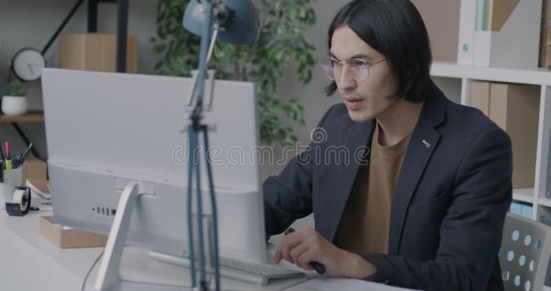 Asian Office Worker Using Computer Typing Pointing at Screen with Happy ...