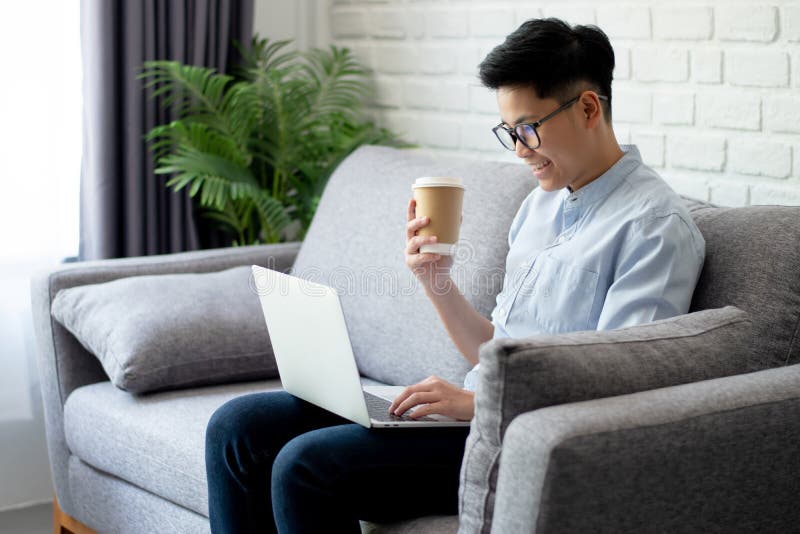 Asian People Work in Laptops on the Sofa at Home Stock Image - Image of ...