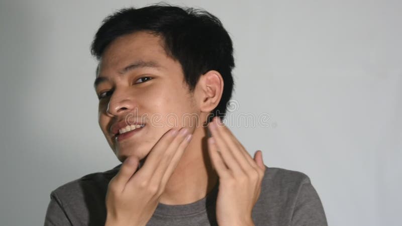 A Man Primping and Preening Stock Footage - Video of cleaning, primping ...