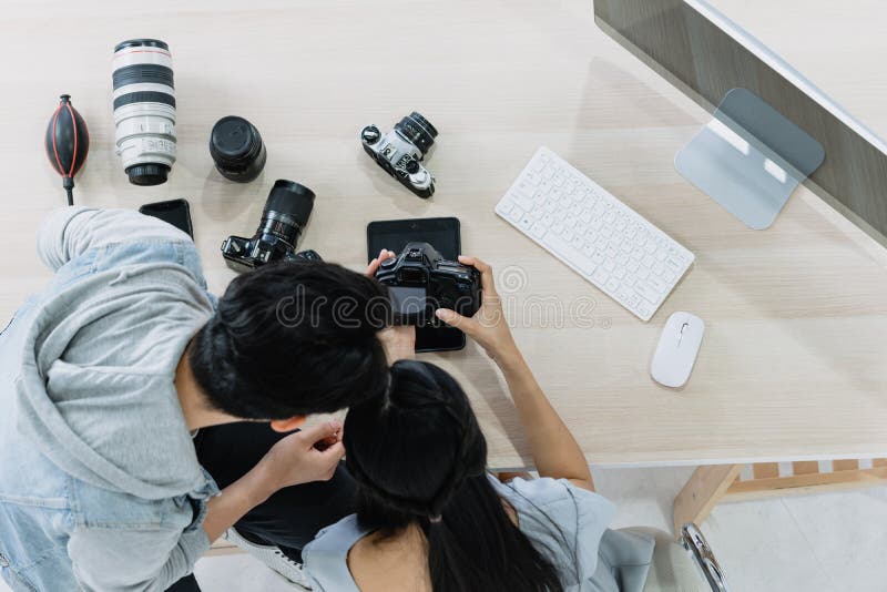 Asian Photographer and Model Looking Pictures from Camera Stock Image ...