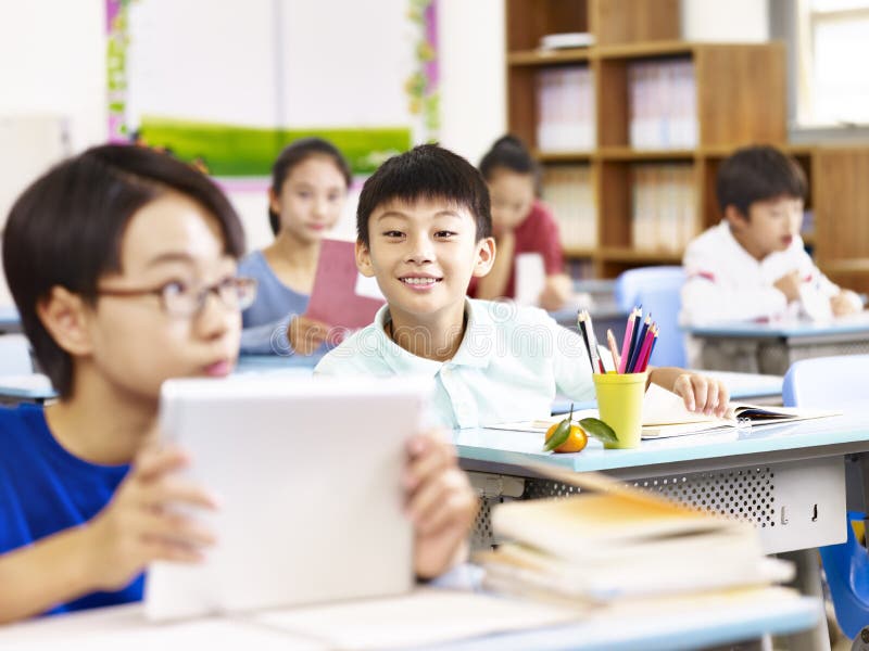 Asian Elementary School Students Working in Groups Stock Photo - Image ...