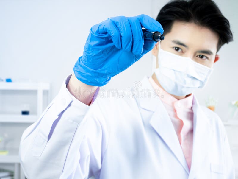Asian Professional Scientist Male Working and Writing Formula by Marker ...