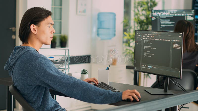 Asian Programer Developing Database Interface And Writing Server Code Stock Image Image Of
