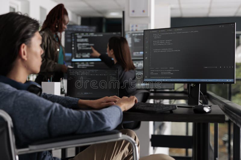 Asian Programmer With Physical Disability Typing Html Code On Computer