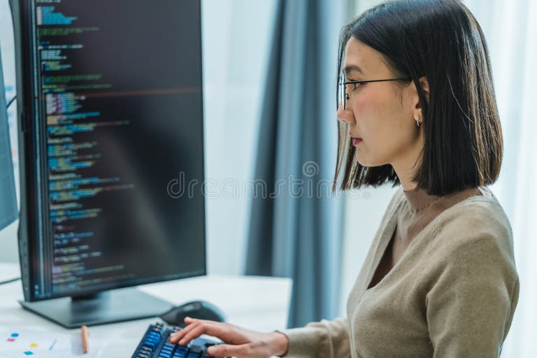 Asian Prompt Engineer Develop Coding App with Software Data Sitting in ...