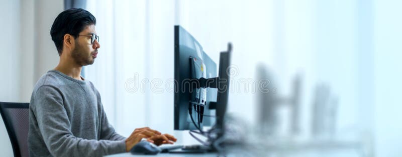 Asian Promt Engineer Develope Coding App With Software Data Sitting In Front Of Computer Monitor
