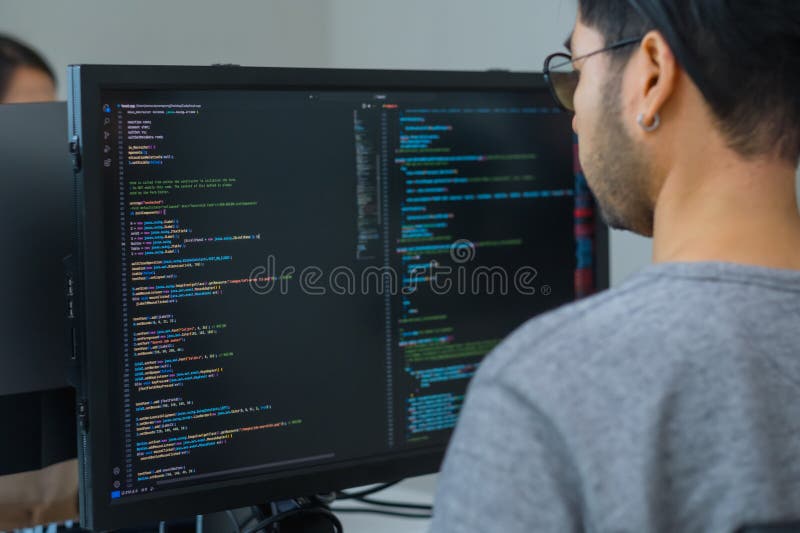 Asian Promt Engineer Develope Coding App With Software Data Sitting In Front Of Computer Monitor