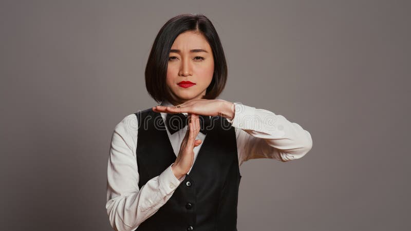 Asian Receptionist Expressing Timeout Symbol on Camera Stock Photo ...