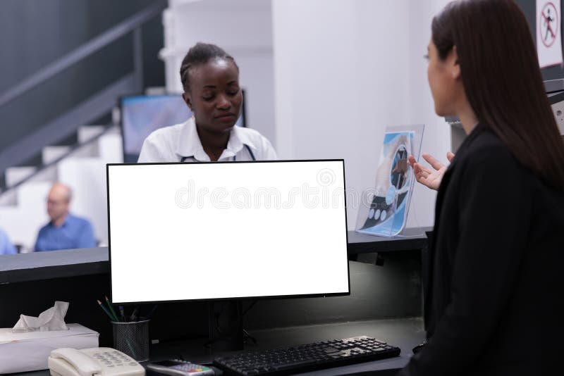 Asian Receptionist Using White Screen on Computer while Working at ...