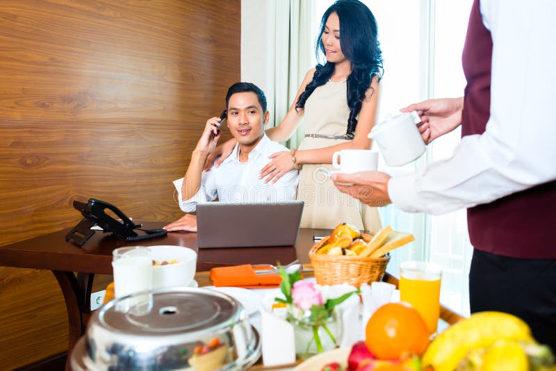 Asian Room Service Waiter Serving Breakfast in Hotel Stock Photo ...