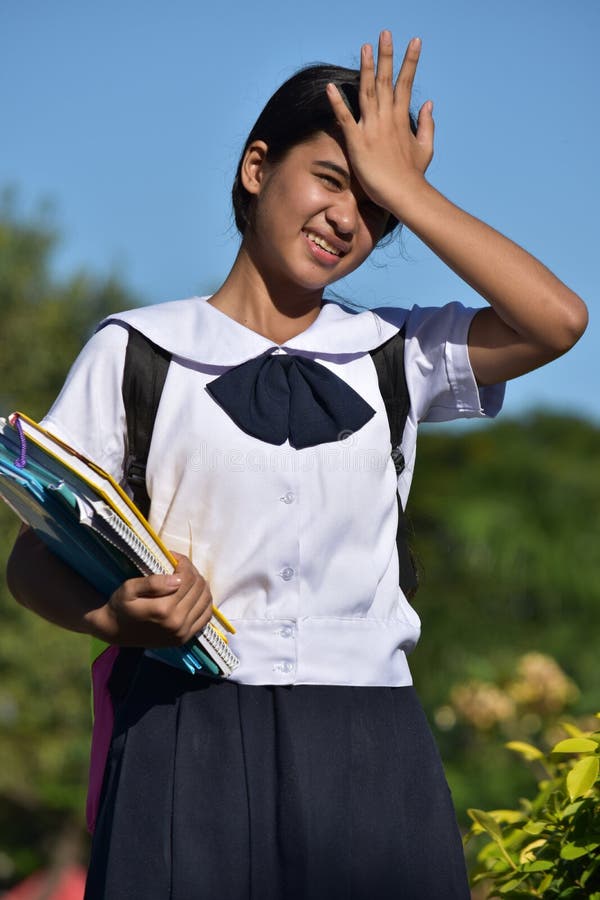 Asian School Girl Memory Problems Wearing School Uniform with Textbooks ...