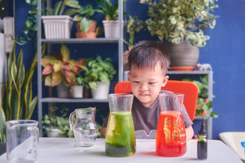 Asian School Kid Studying Science, Making DIY Lava Lamp Science ...