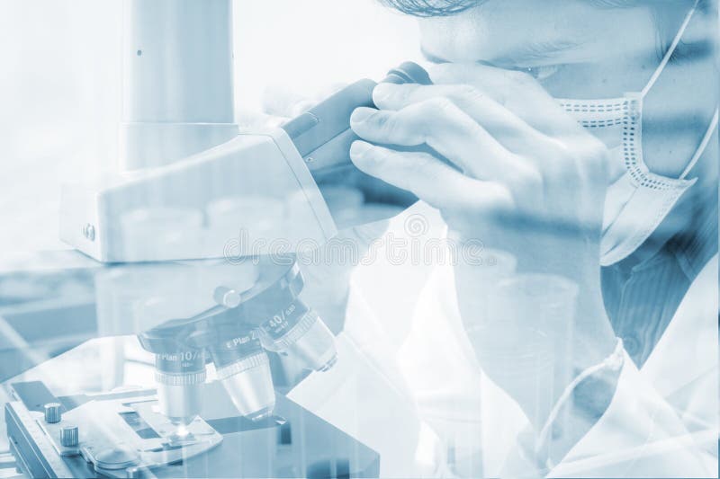 Scientist Looking through a Microscope for Chemistry Test Samples Stock ...