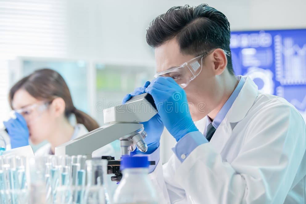 Asian Scientist Use Microscope Stock Photo - Image of analyzing ...