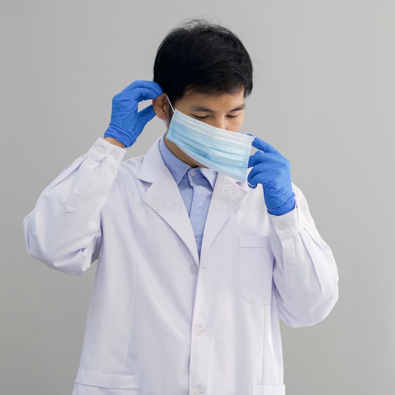 Asian Scientist Waring a Face Mask before Beginning the Experiment in a ...