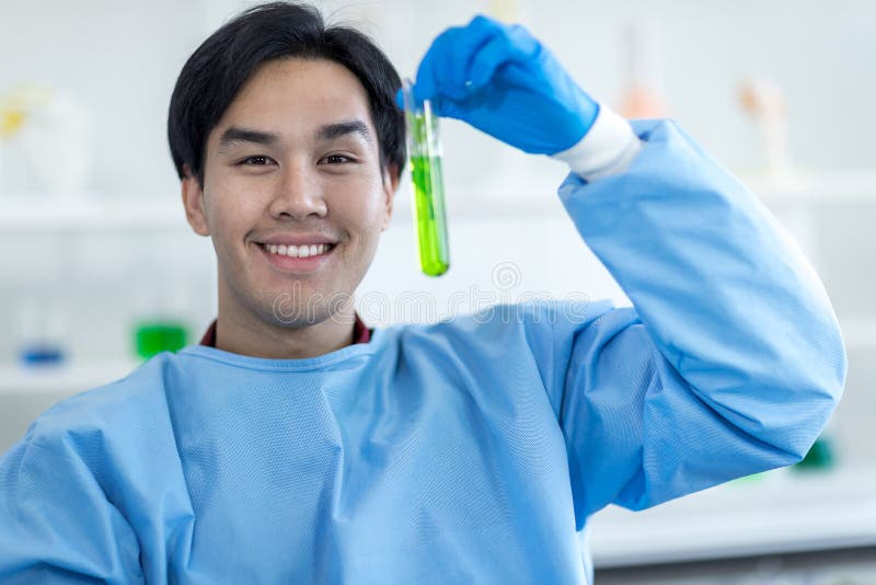 Asian Scientists Wear Protective Clothing in the Laboratory Stock Photo ... Asian Scientists Wear Protective Clothing in the Laboratory Stock Photo ...