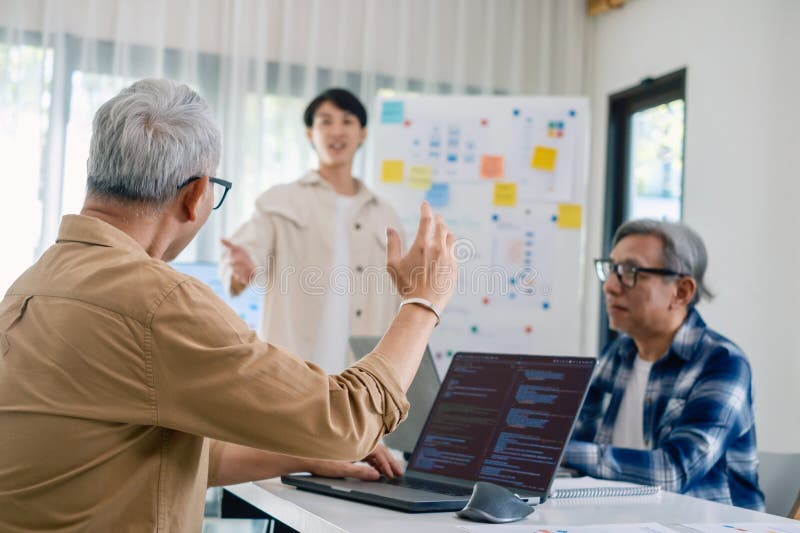 Asian Senior Bootcamp Team Asking and Learning Programming with Software Training and Whiteboard ...