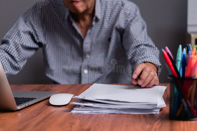 Asian Senior Businessman Checking Work Papers and Business Reports ...