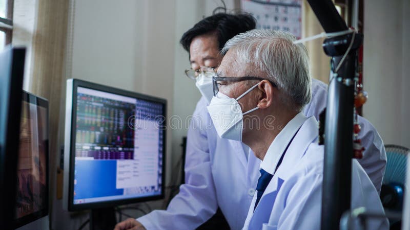 Asian Senior Elder Doctors Wearing Mask Looking at Computer Screen ...
