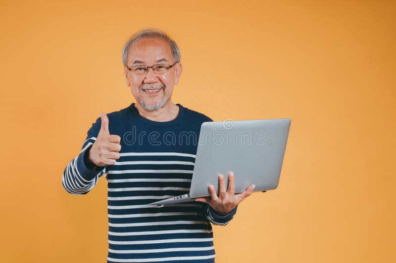 Asian Senior Man Using Laptop Computer for Working after Retirement on ...