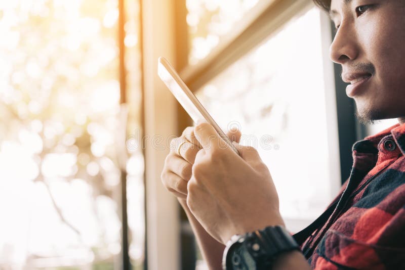 Asian Man Using Smartphone at Home. Stock Photo - Image of holding ...