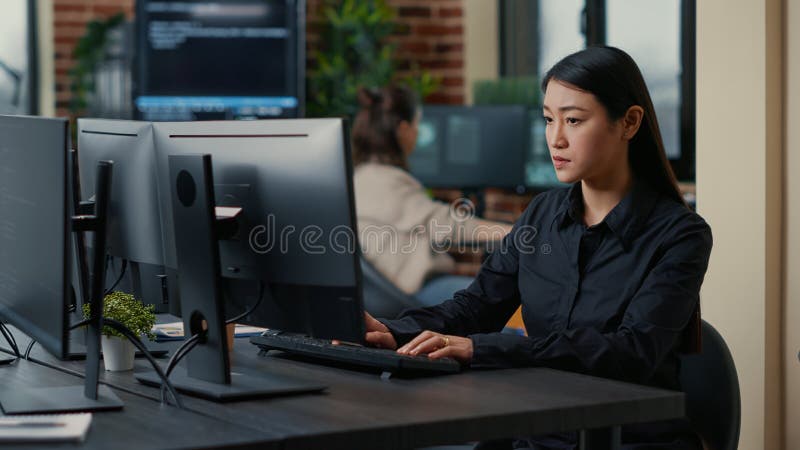 Software Developer Writing Algorithm in Front of Computer with Green ...