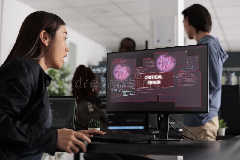 Asian Software Developer Writing Html Code Encountering Hacking Alert On Computer Stock Image