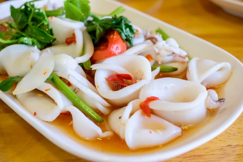 Asian Spicy Squid Salad on White Plate Stock Photo - Image of white ...