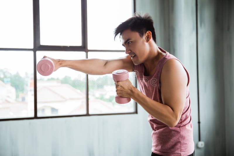 Man Using Dumbbell Doing Some Boxing Exercise Stock Photo - Image of ...
